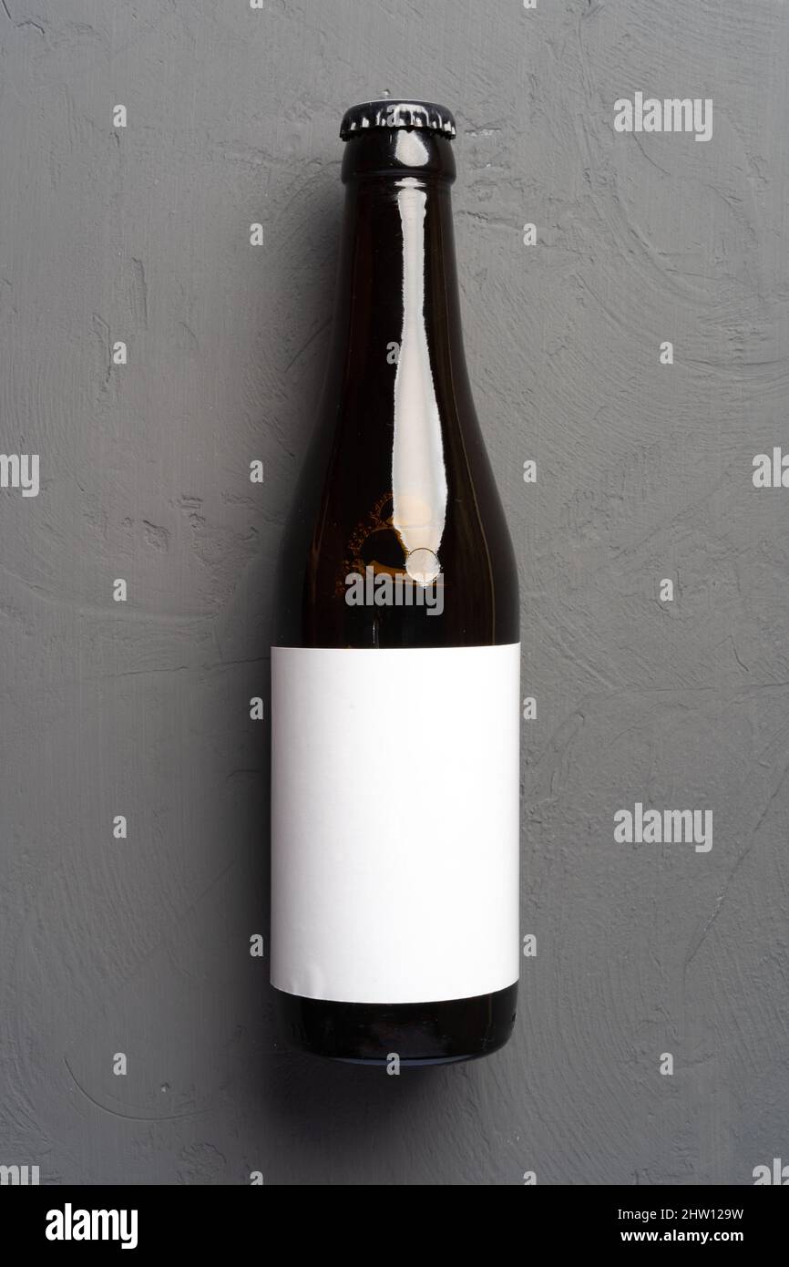 Beer bottle, on gray stone background, top view, with copy space for ...