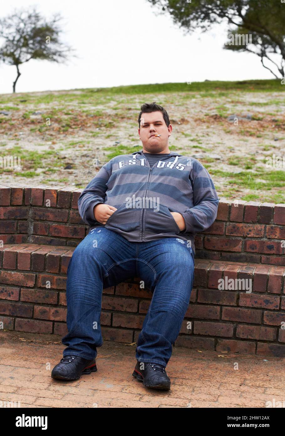Fat man sitting on bench hi-res stock photography and images - Alamy