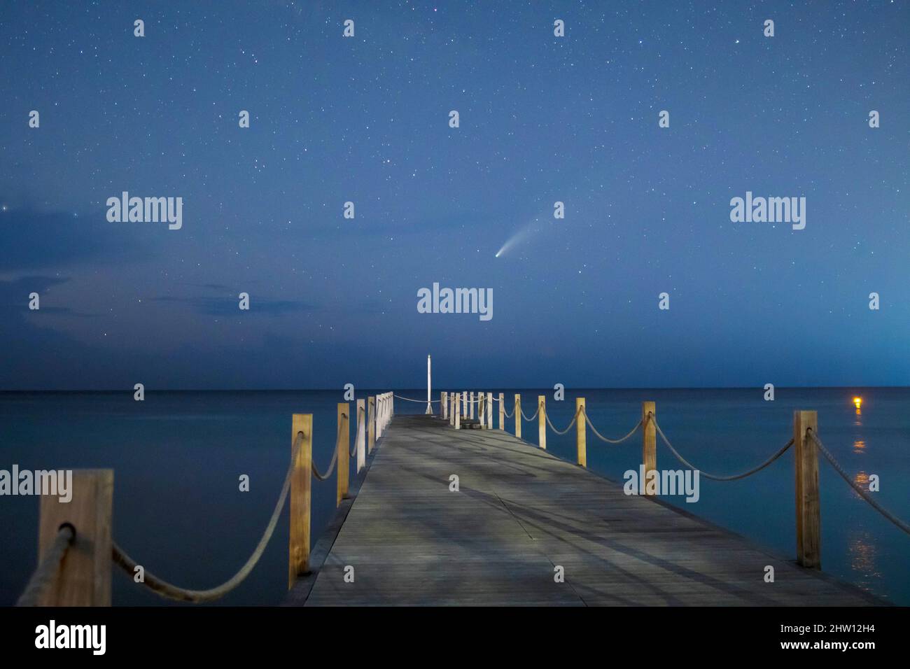 Landscape view of a pier on the beach and starry sky Stock Photo - Alamy