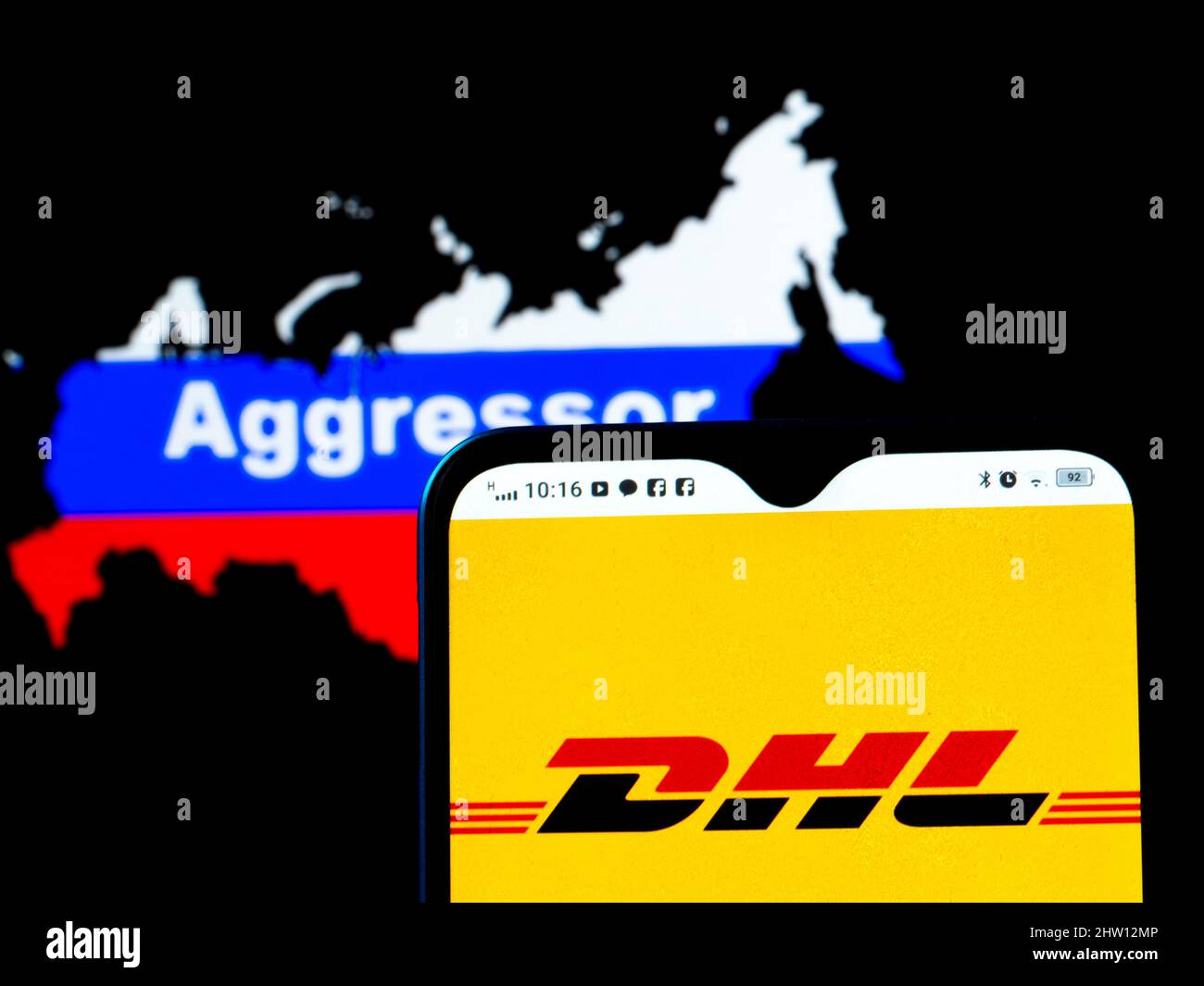 In this photo illustration, the DHL logo is displayed on a smartphone ...