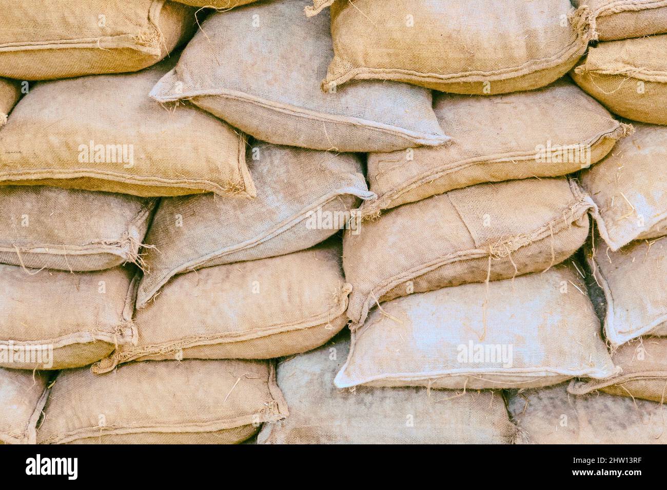 Background of lying dirty sandbags. Sandbag flood protection wall ...