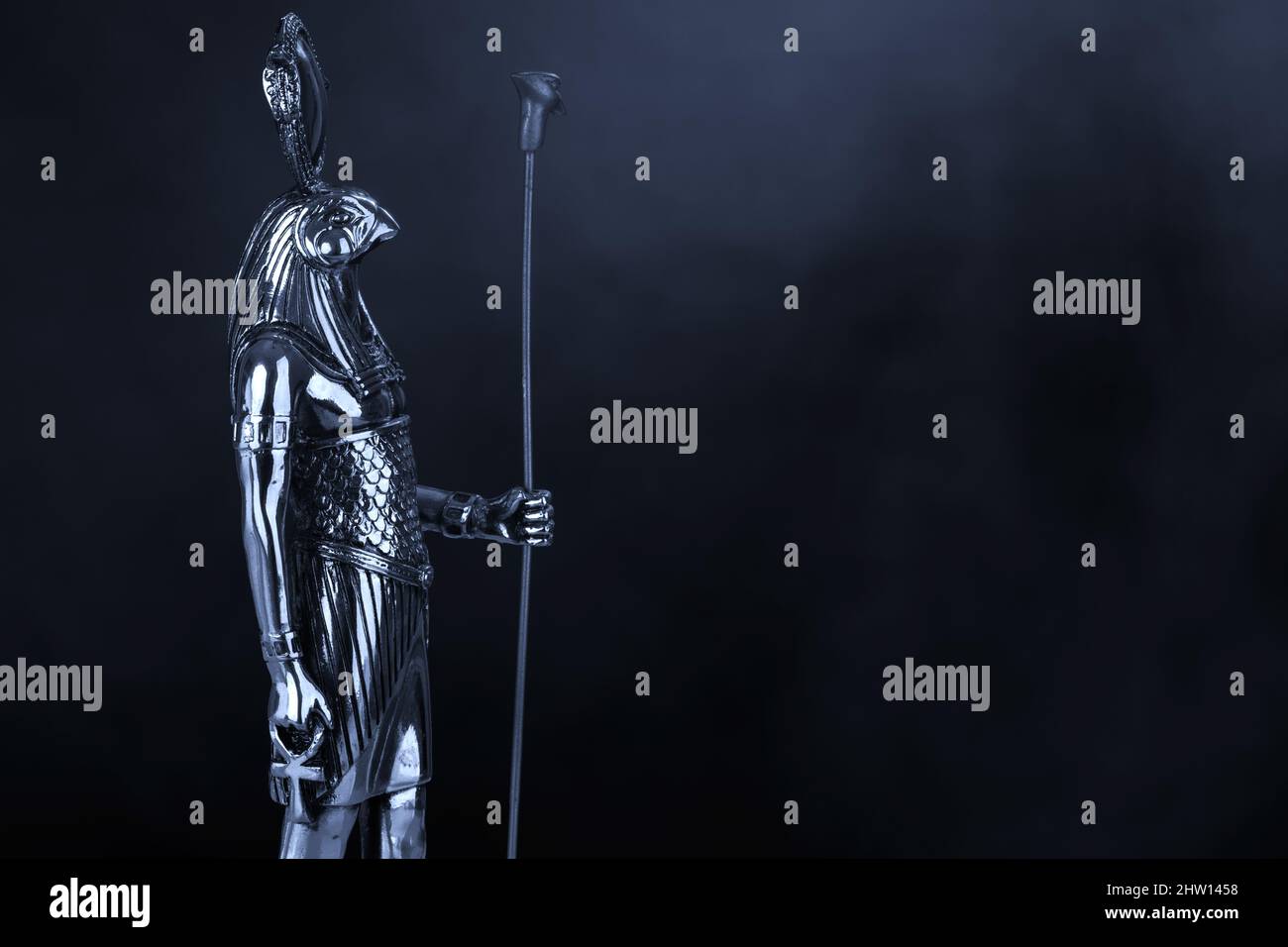 metal steel statue of the Egyptian sun god Ra on a black background ...