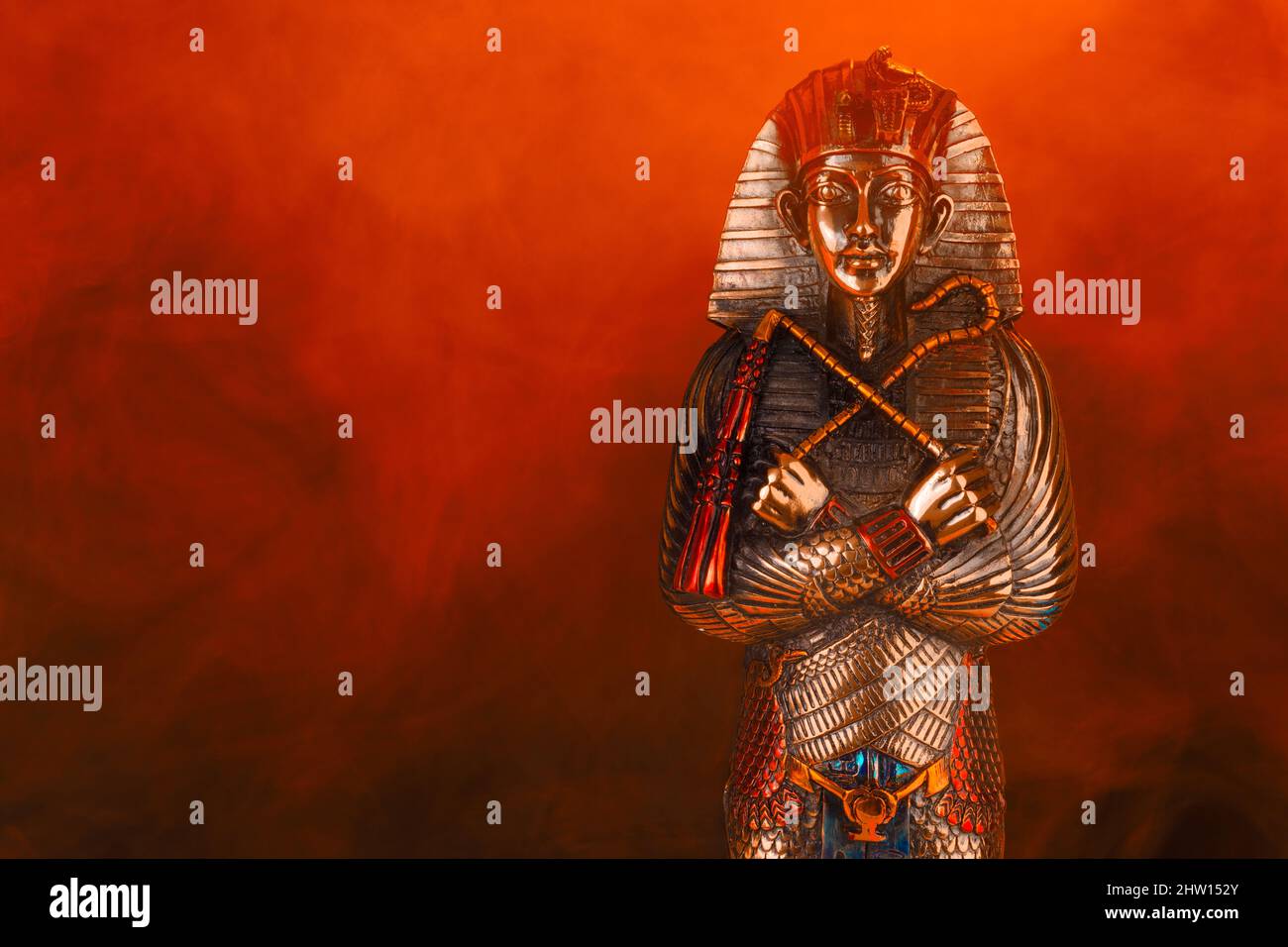 egyptian golden pharaoh statue in red smoke. High quality photo Stock ...