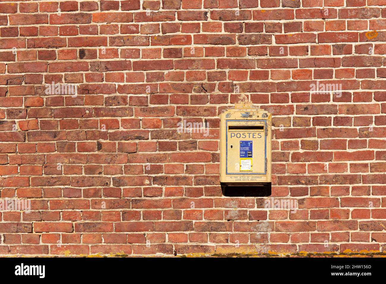 Official french mail boxes on a brick wall Stock Photo - Alamy
