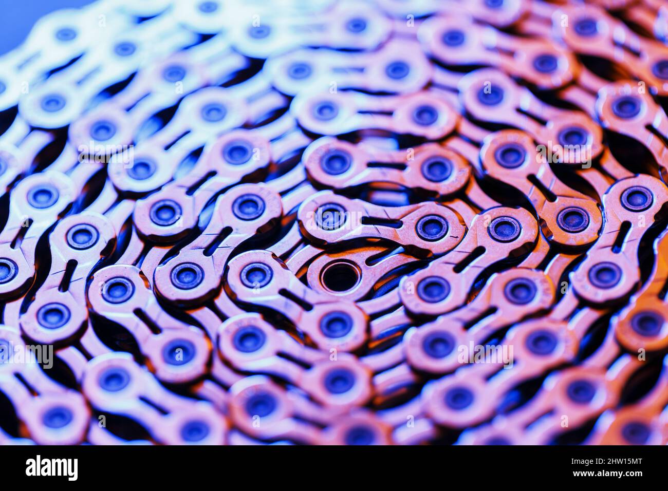 Patterns of a technological bicycle chain braided in a circle with blue ...