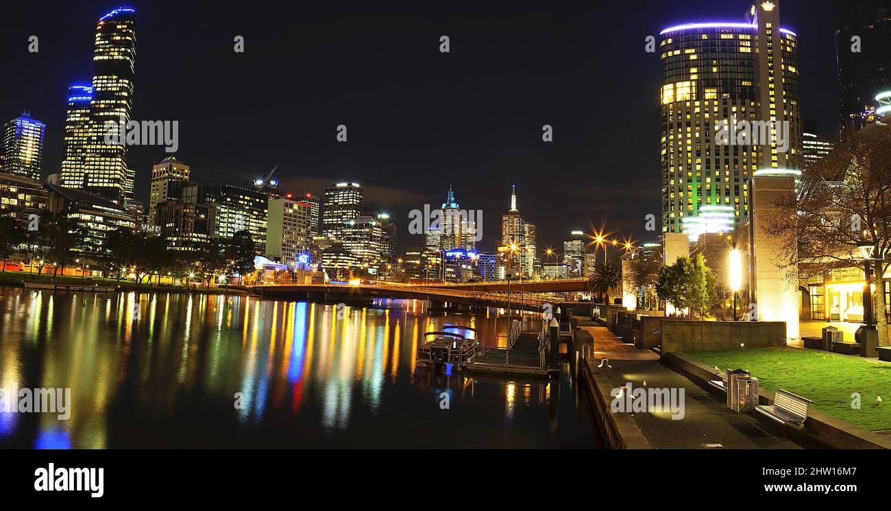 View of a modern megalopolis at night with many skyscrapers and lights ...