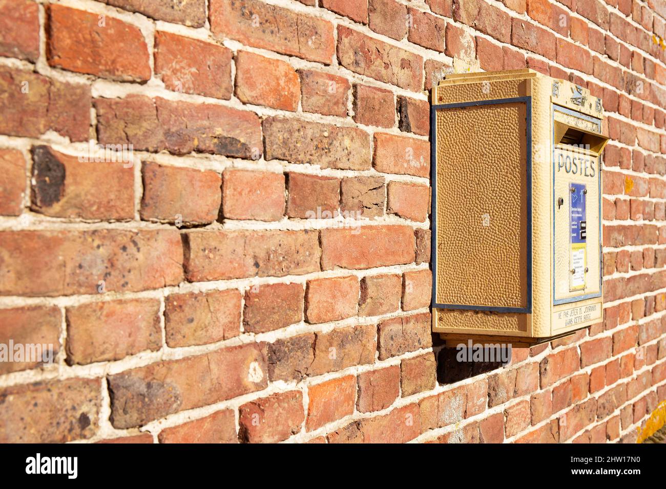 Official french mail boxes on a brick wall Stock Photo - Alamy