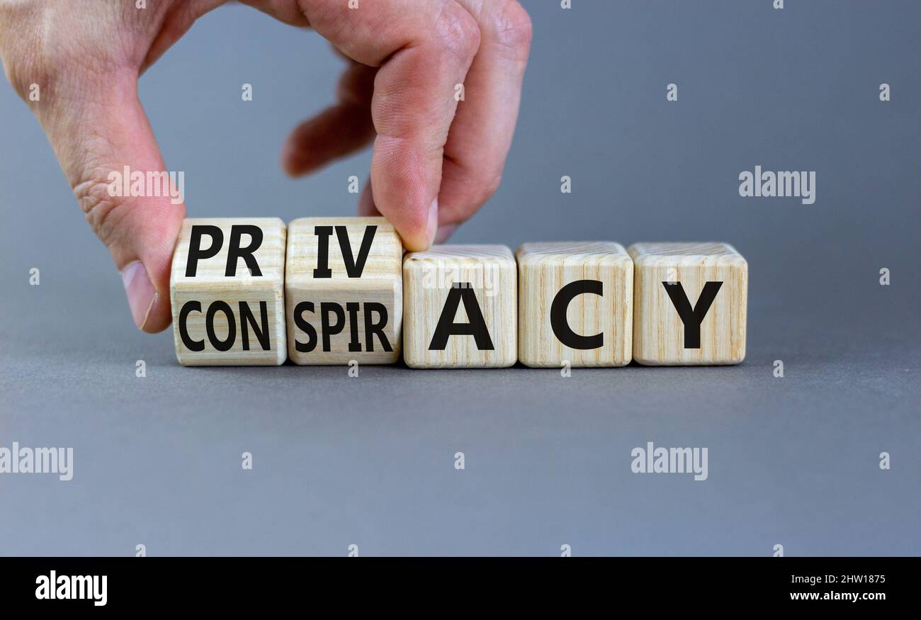 Privacy or conspiracy symbol. Businessman turns wooden cubes and ...
