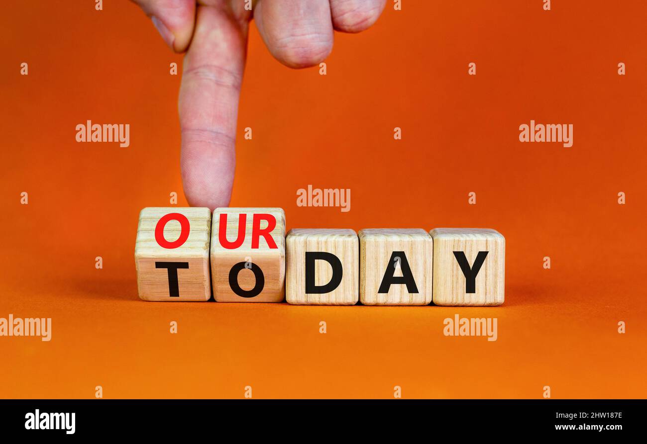 Today is our day symbol. Businessman turns wooden cubes and changes ...