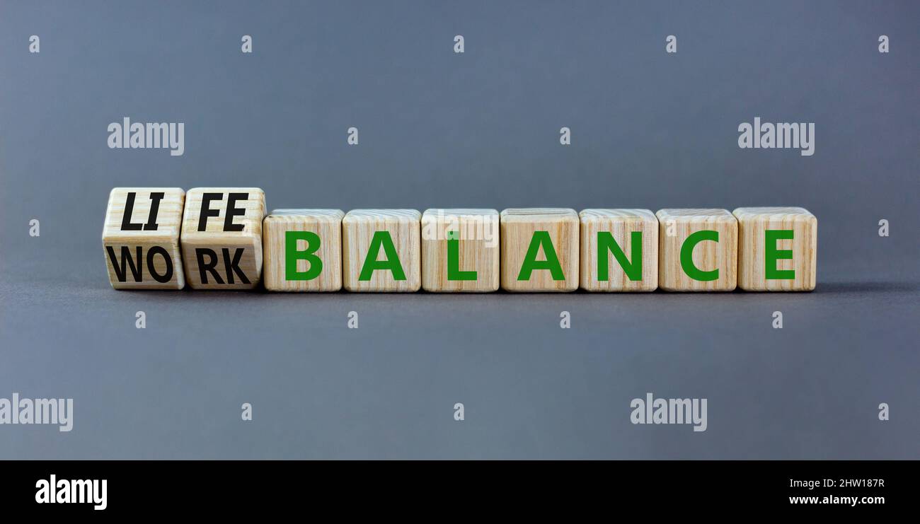 Work life balance symbol. Turned wooden cubes and changed concept words ...