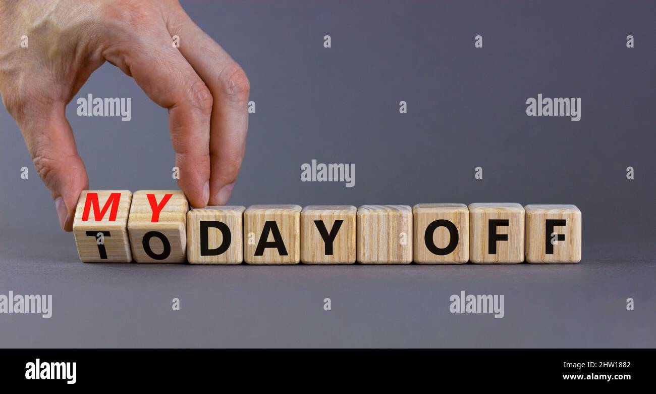Today is my day off symbol. Businessman turns cubes and changes concept ...