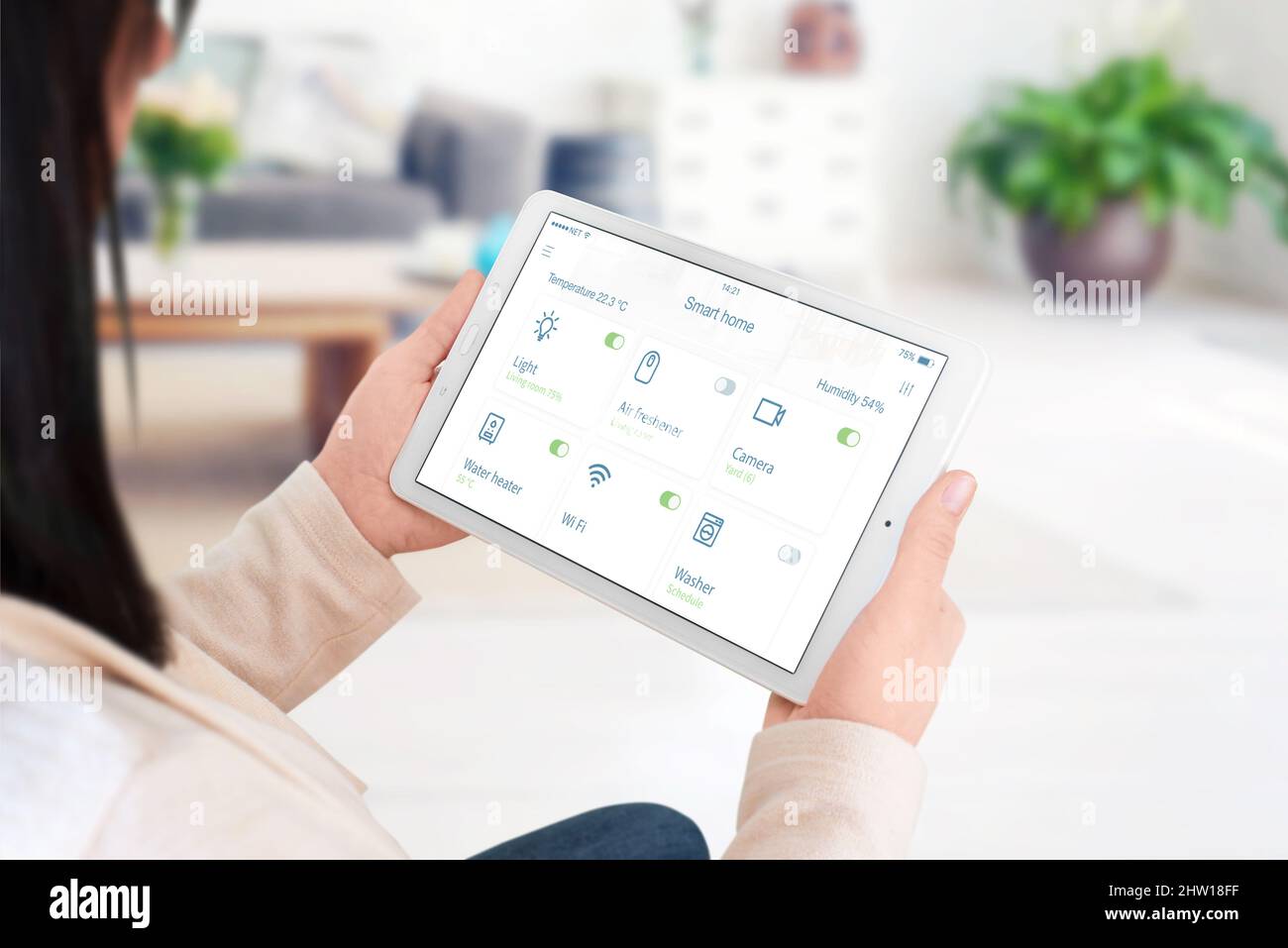 Home devices control on modern smart home app on tablet display in ...