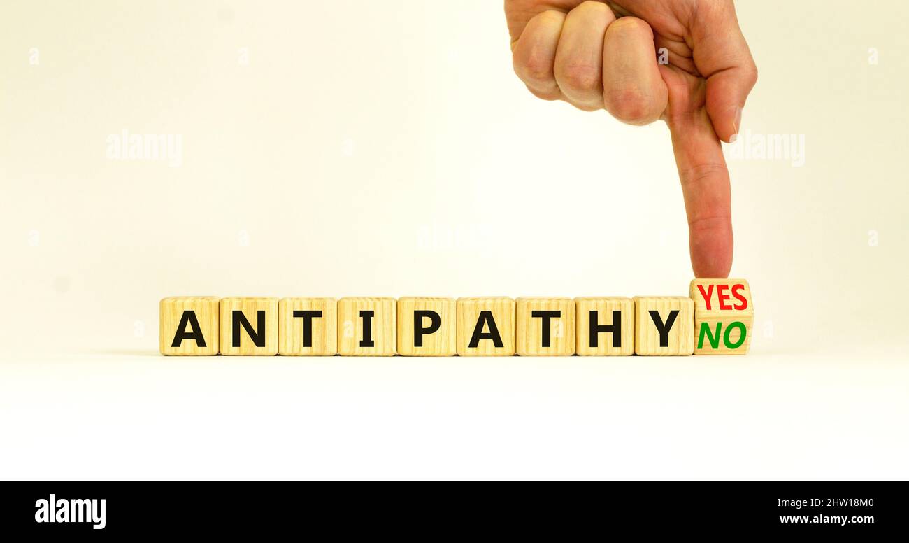 Antipathy yes or no symbol. Psychologist turns a wooden cube and change ...