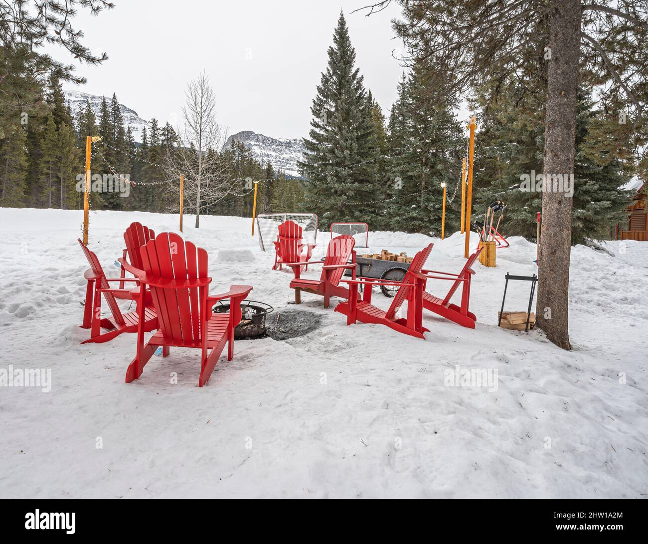 Winter fire pit with red chairs in Banff National Park, Alberta, Canada ...