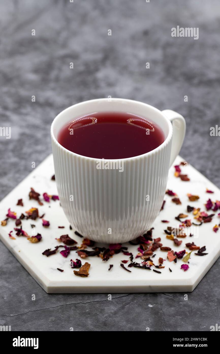 Pomegranate tea on a dark background. Herbal tea prepared with ...