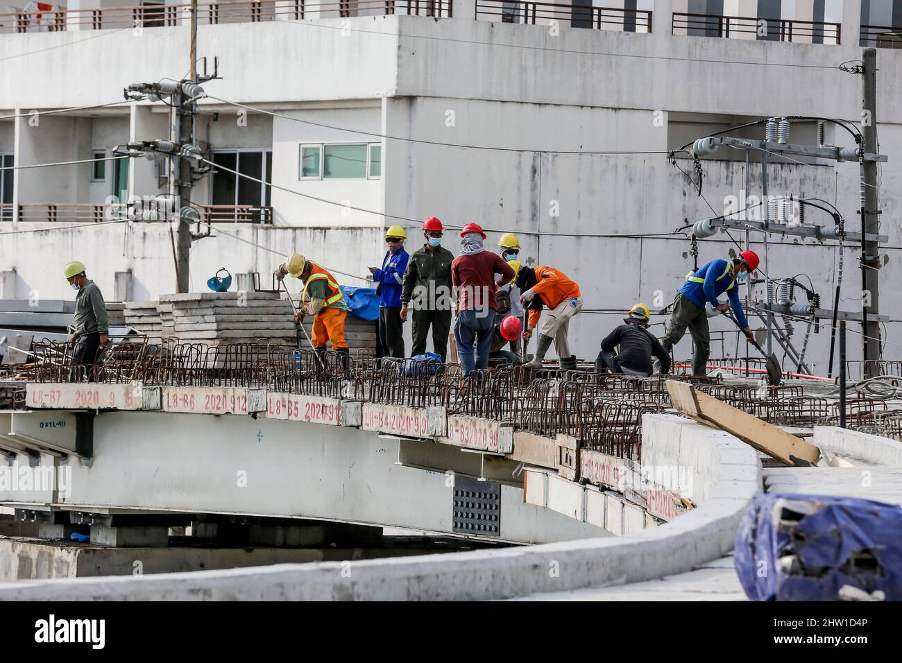 Manila. 3rd Mar, 2022. Workers are seen on the construction site of the ...