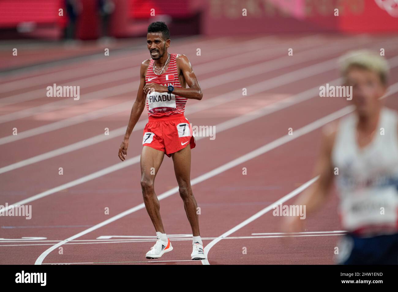 Dawit Fikadu at the finish line at the 2020 Tokyo Olympics in the 5000m ...