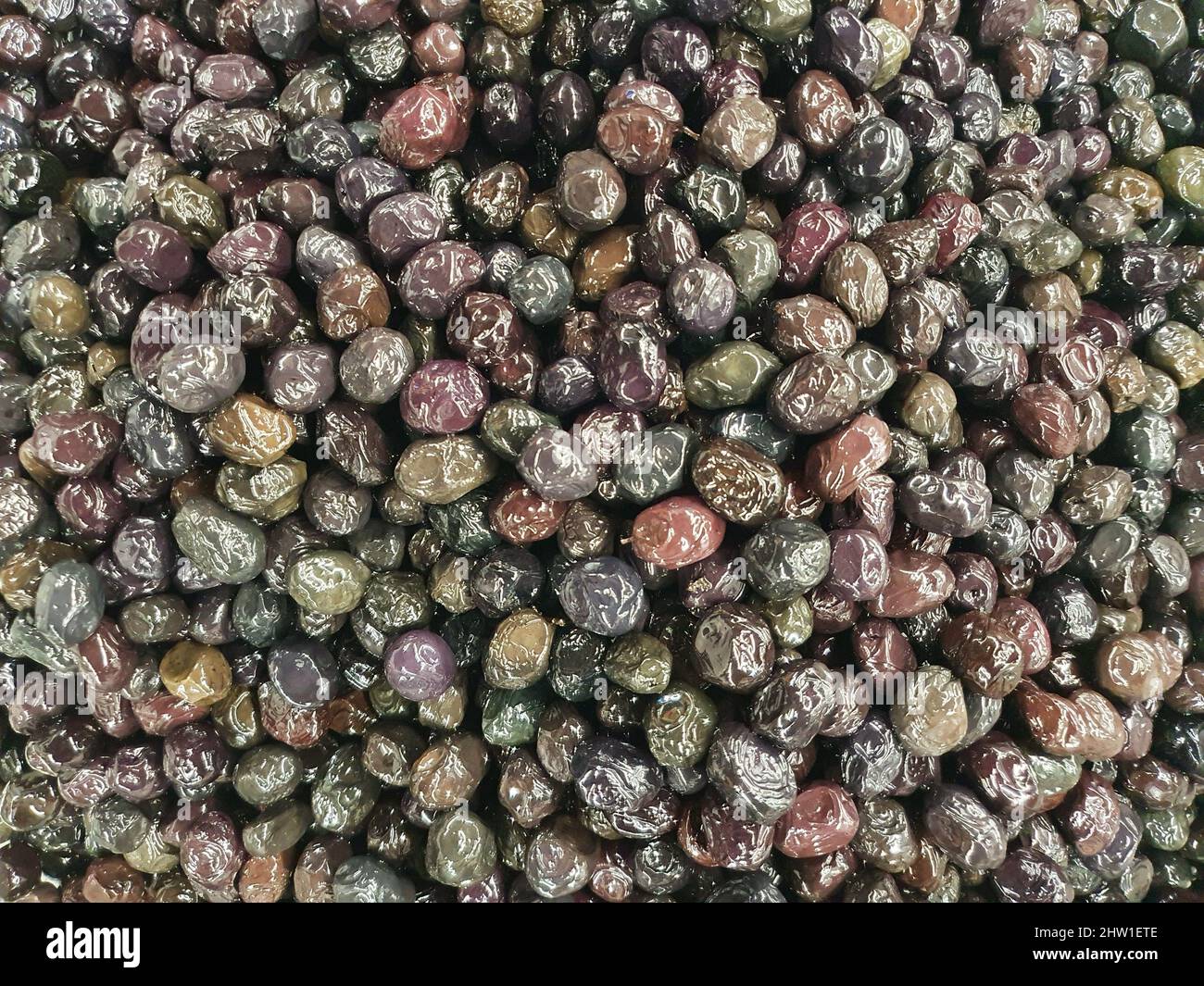 Black and brown organic olive varieties in the market Stock Photo - Alamy