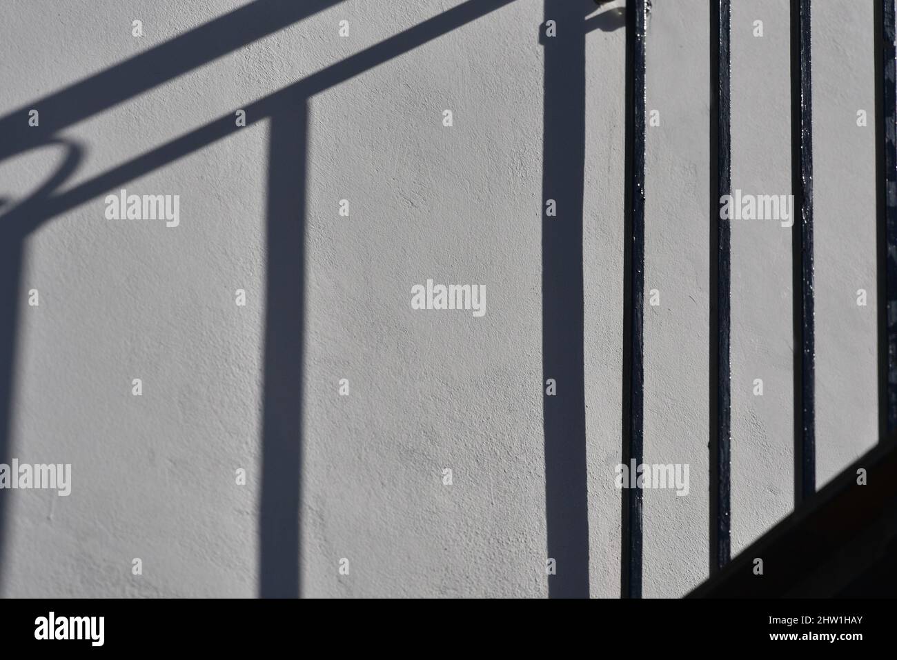 Traditional handcrafted wrought iron balcony railing against a ...