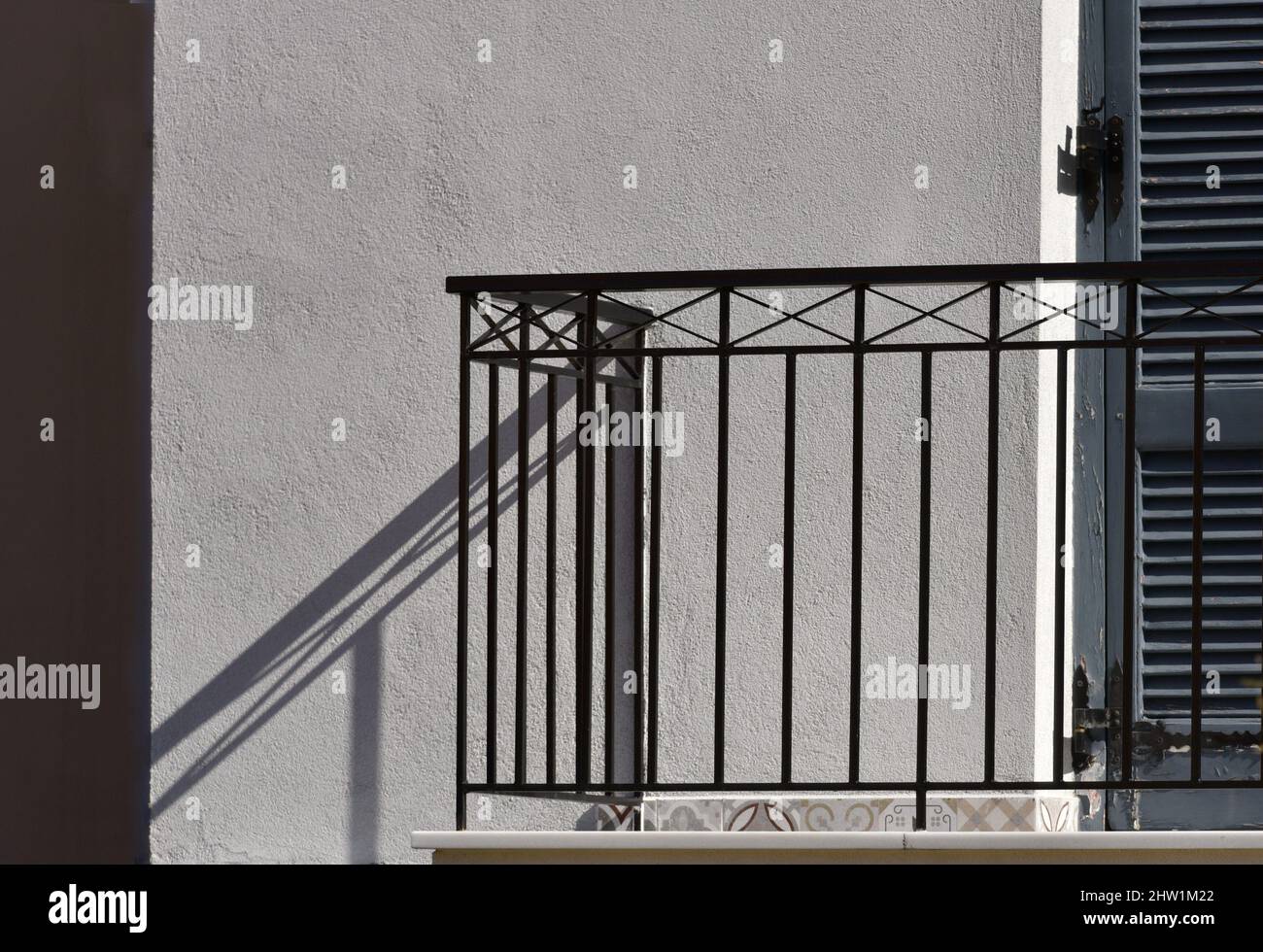 Old Neoclassical house balcony with a handcrafted wrought iron railing ...