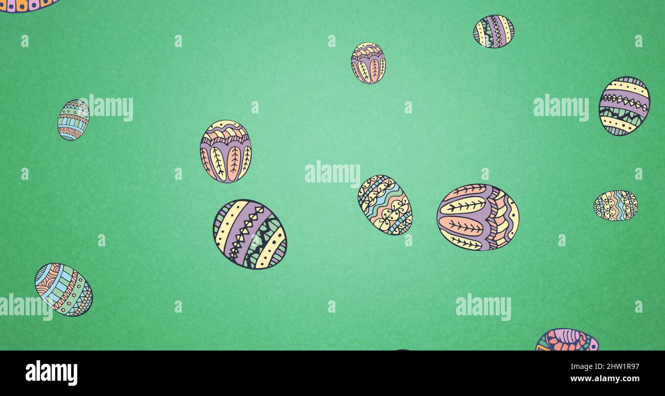 Image of easter eggs falling on green background Stock Photo - Alamy
