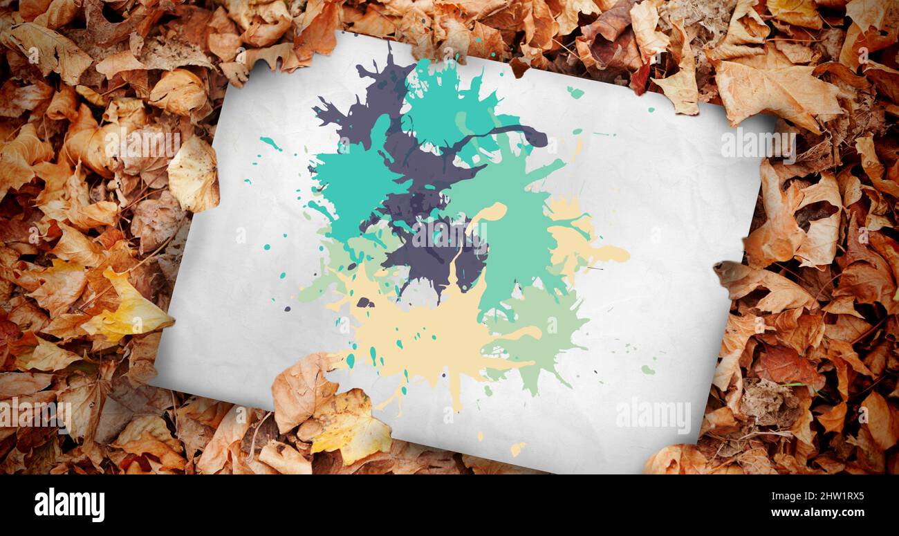 Image of multiple colorful stains over white paper and leaves Stock ...