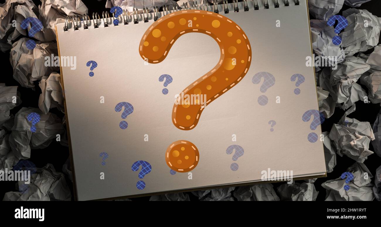 Image of question marks over notebook and paper Stock Photo - Alamy
