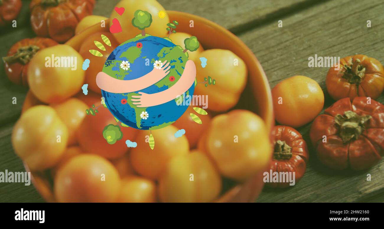 Image of arms wrapped around planet earth over fresh tomatoes Stock ...