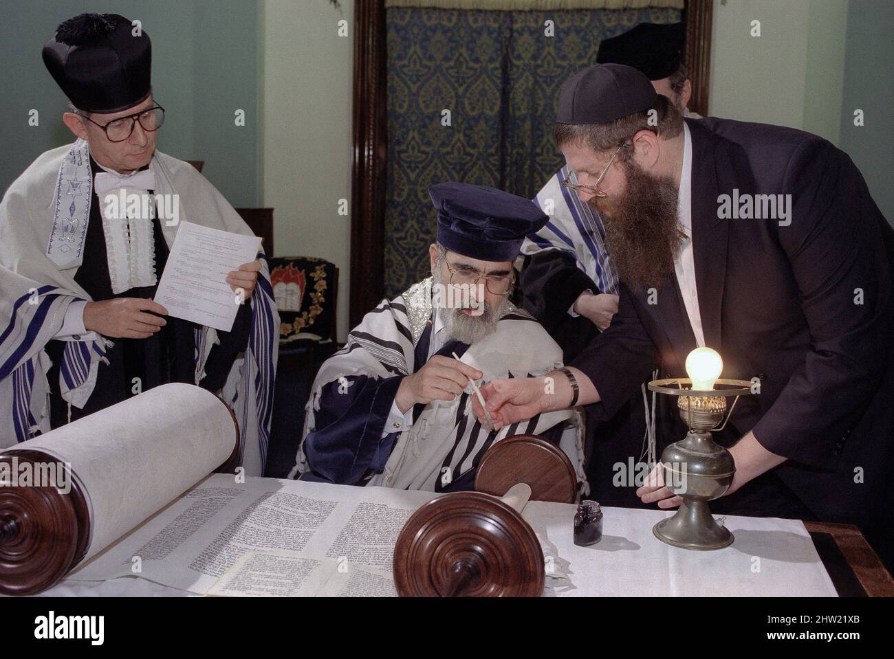 The Chief Rabbi writes the final letter - lamed - onto the end of the ...