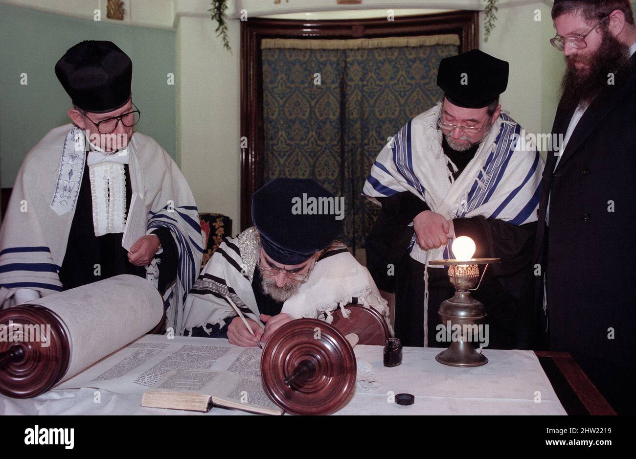 The Chief Rabbi writes the final letter - lamed - onto the end of the ...