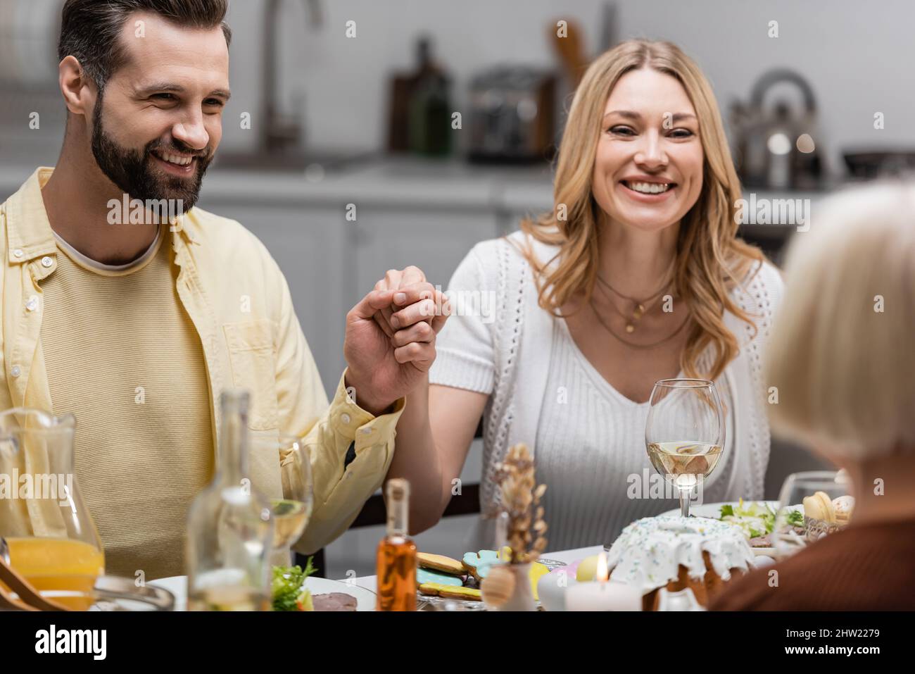 Couple holding hands dinner table hi-res stock photography and images ...