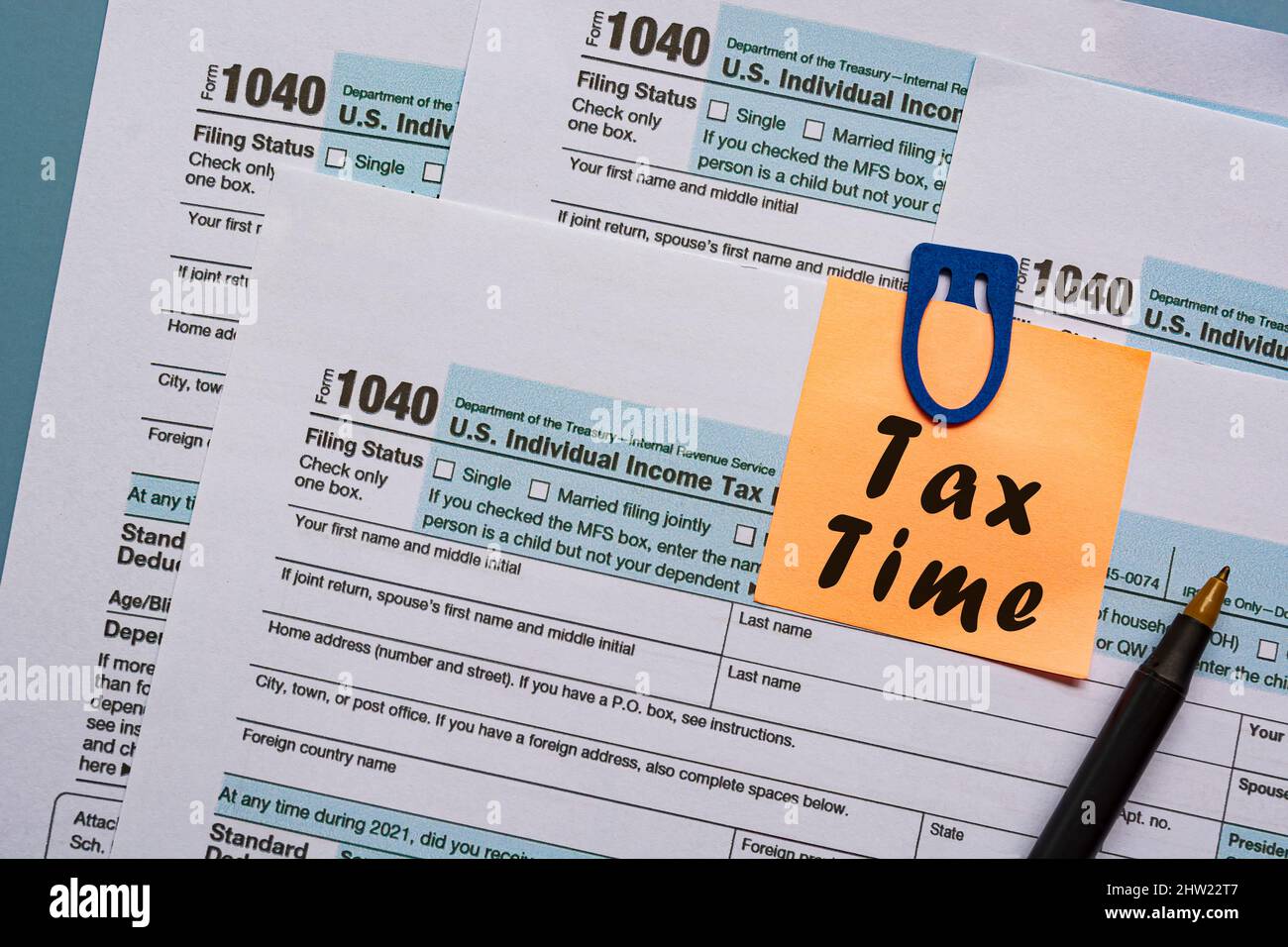 Tax forms 1040. U.S Individual Income Tax Return on a desk with text on ...