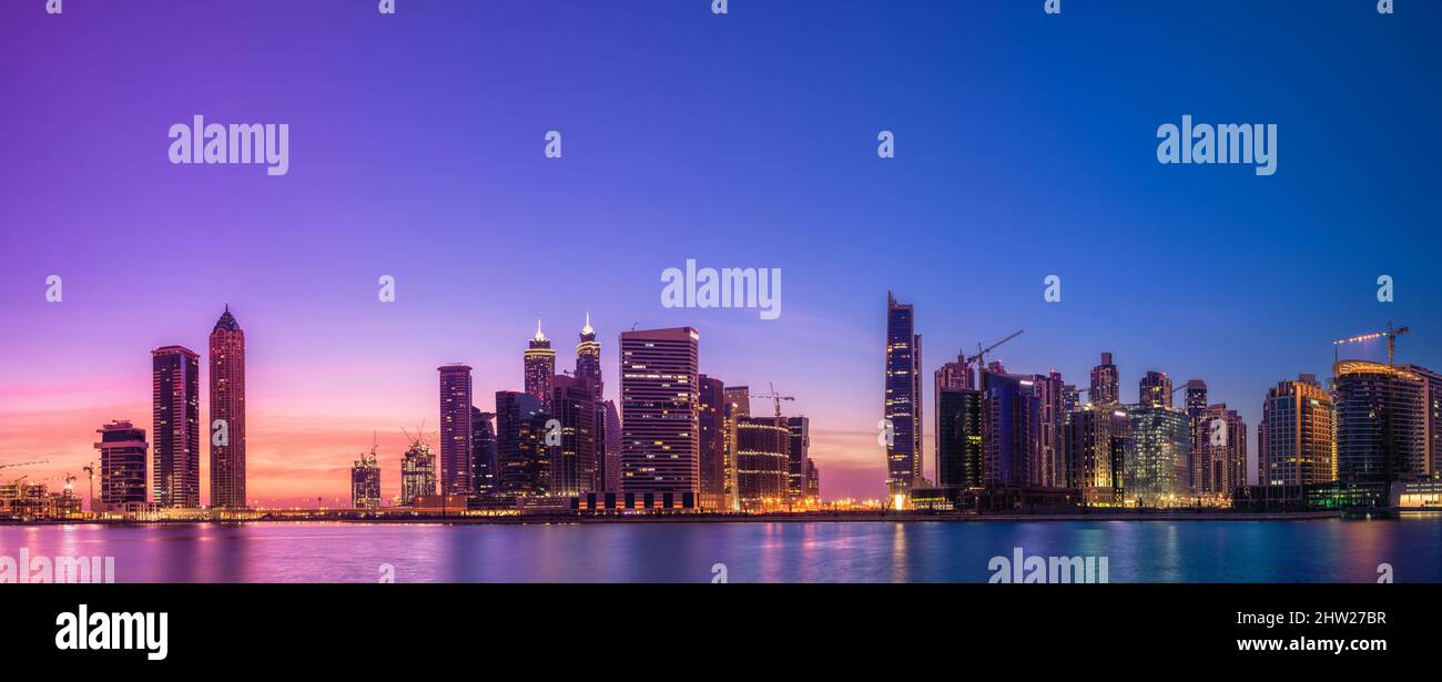 Cityscape of Dubai and panoramic view of Business bay with reflection ...