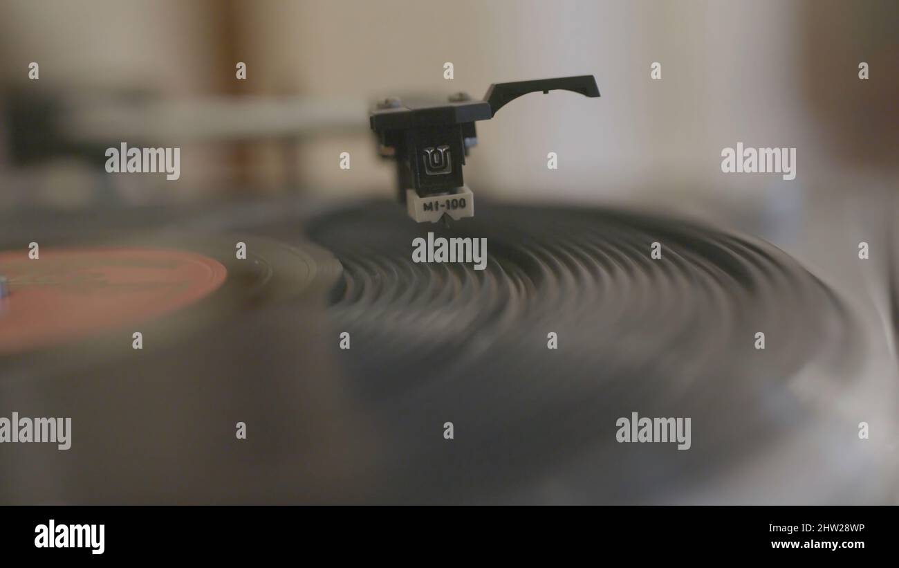 Spinning broken record on record player. Stock. Close-up of broken ...
