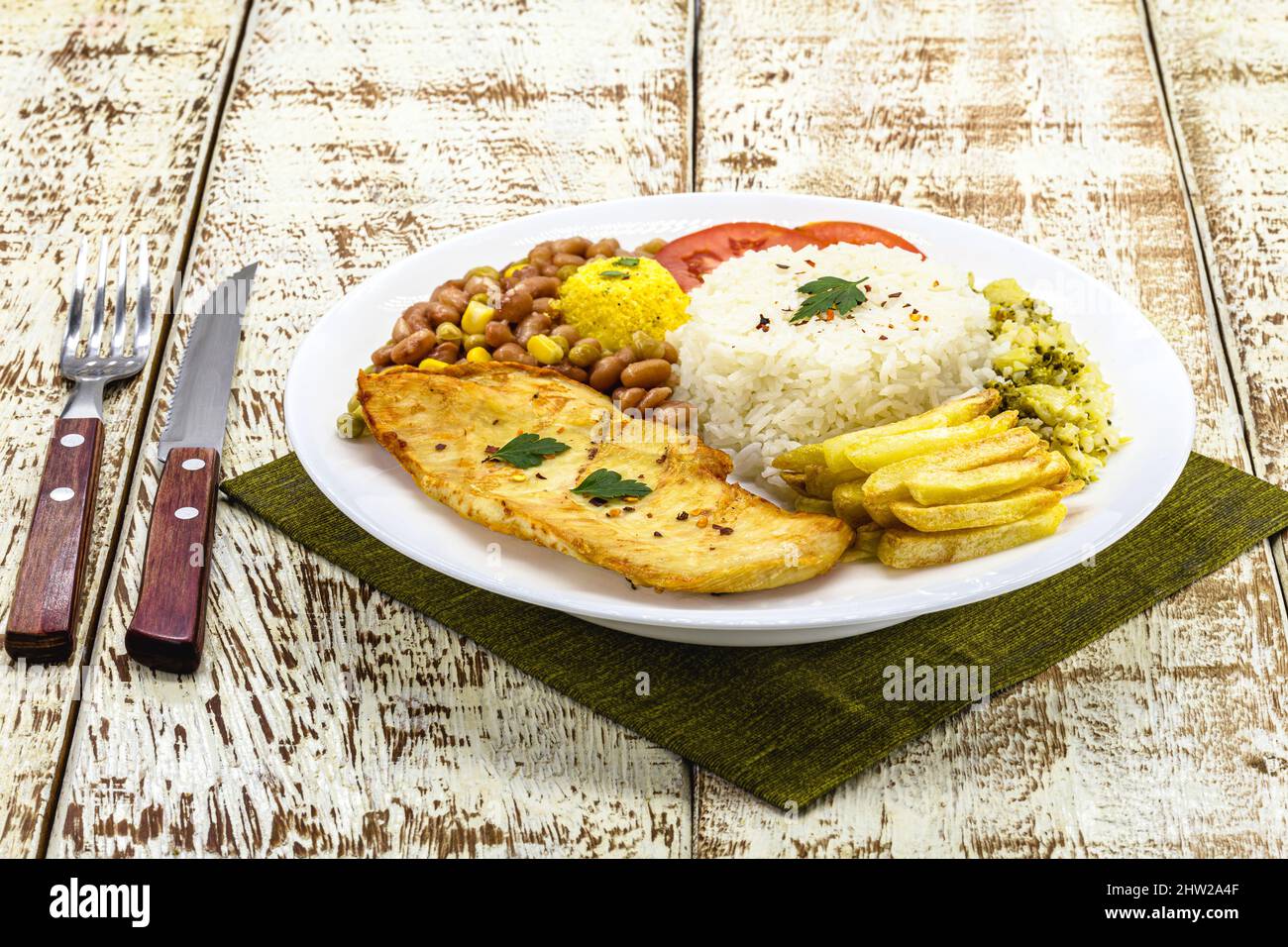plate of rice and beans typical of brazil, homemade food, fried egg ...