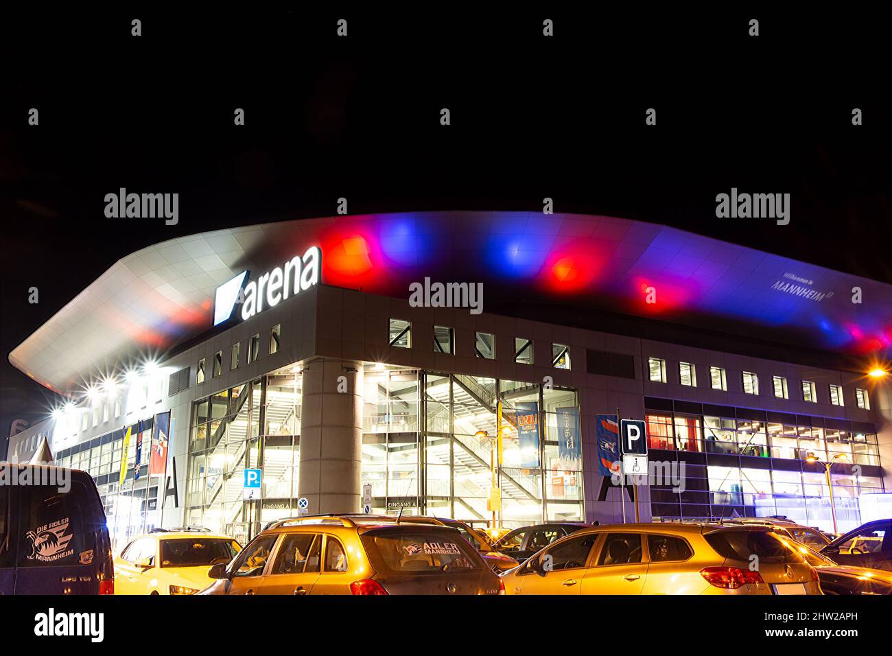 Night shot of the brightly lit SAP Arena in Mannheim during a home game ...