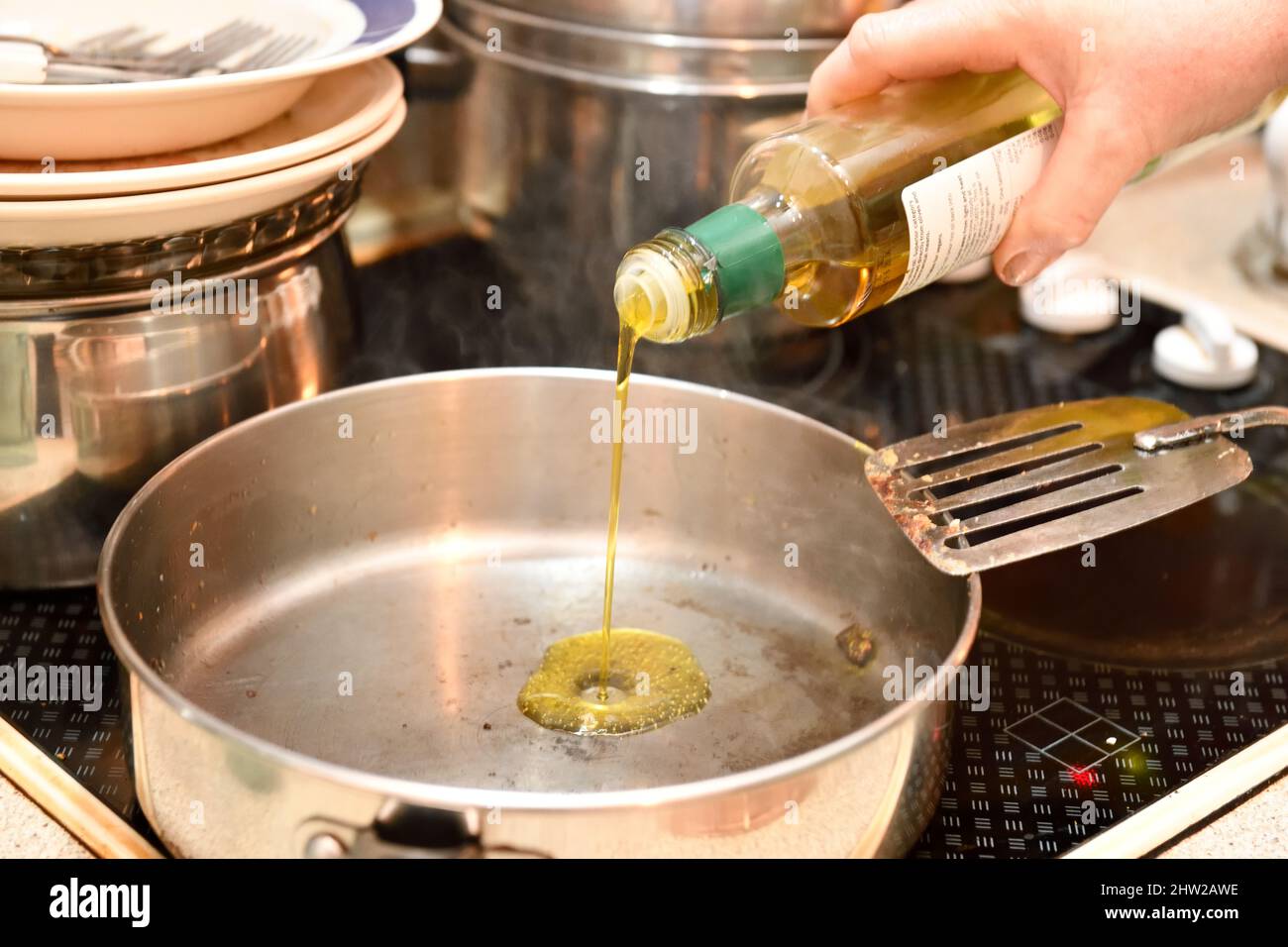 Step 1 Pouring Olive Oil in Frying Pan for Pan Cake Making Stock Photo ...