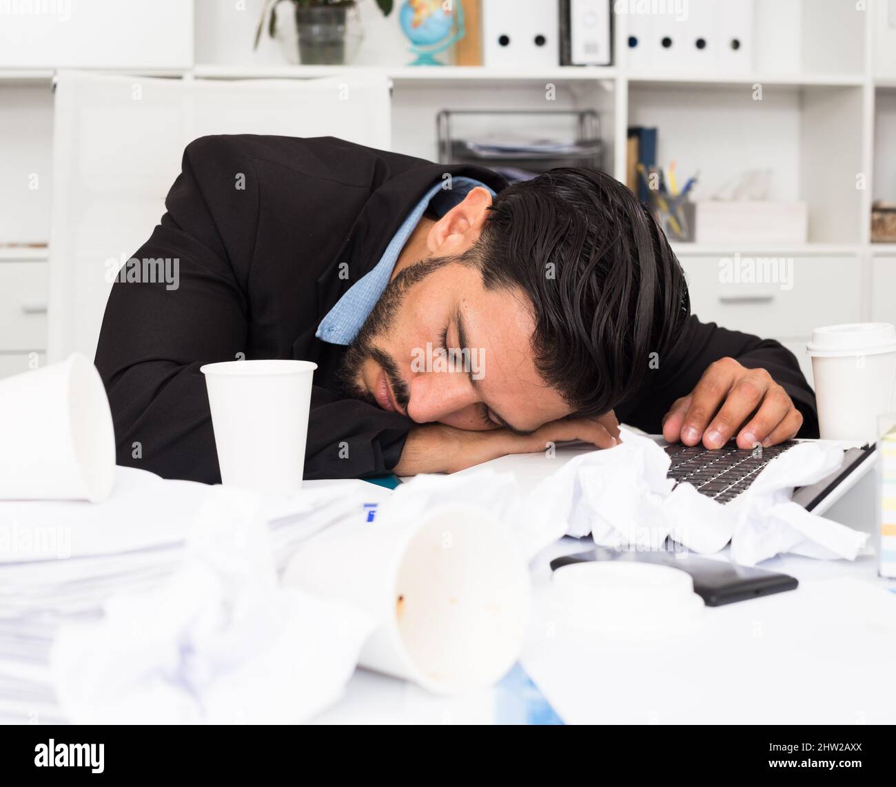 Businessman is resting after productive work day Stock Photo - Alamy