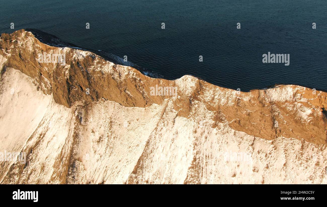 Aerial from flying drone of a little island in open sea. Shot. Top view ...