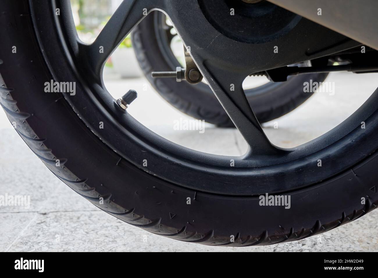 matic motorcycle wheels and black rims. tire valve cap Stock Photo - Alamy