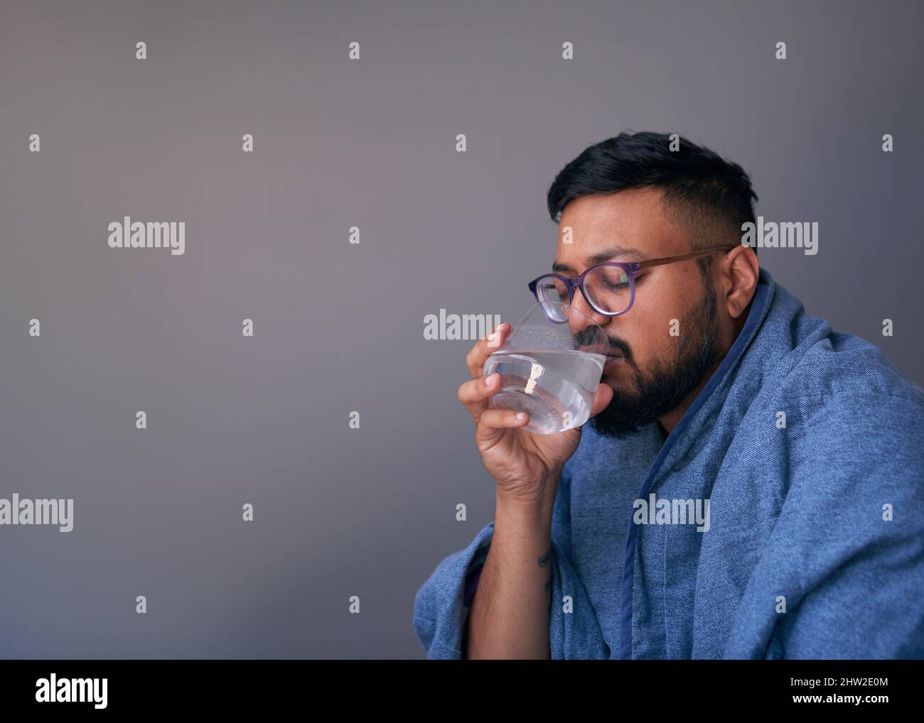 A close up of hands holding an effervescent tablet treating the flu ...
