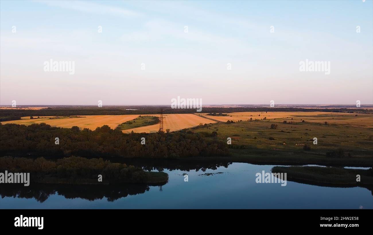 Beautiful panorama of river going to horizon and reflecting blue sky ...