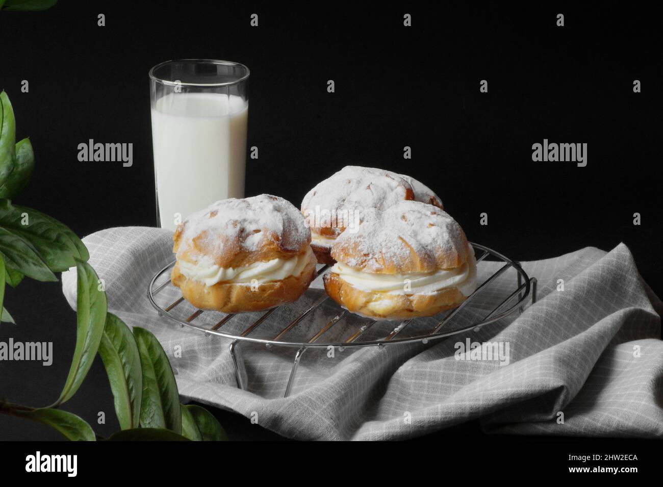 lovely cakes profiteroles eclairs on a stand with a homemade towel and ...