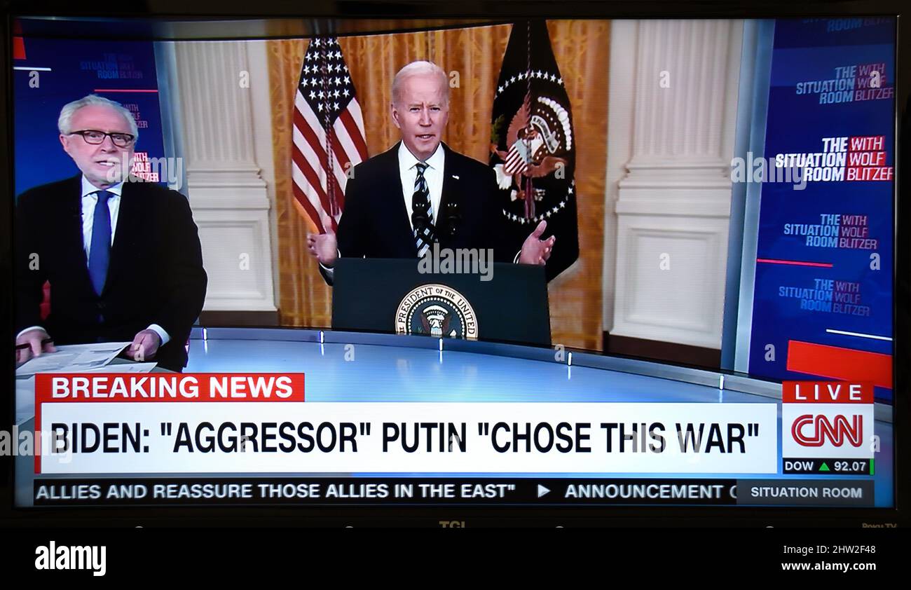 A TV screenshot of CNN news anchor Wolf Blitzer reporting on the ...