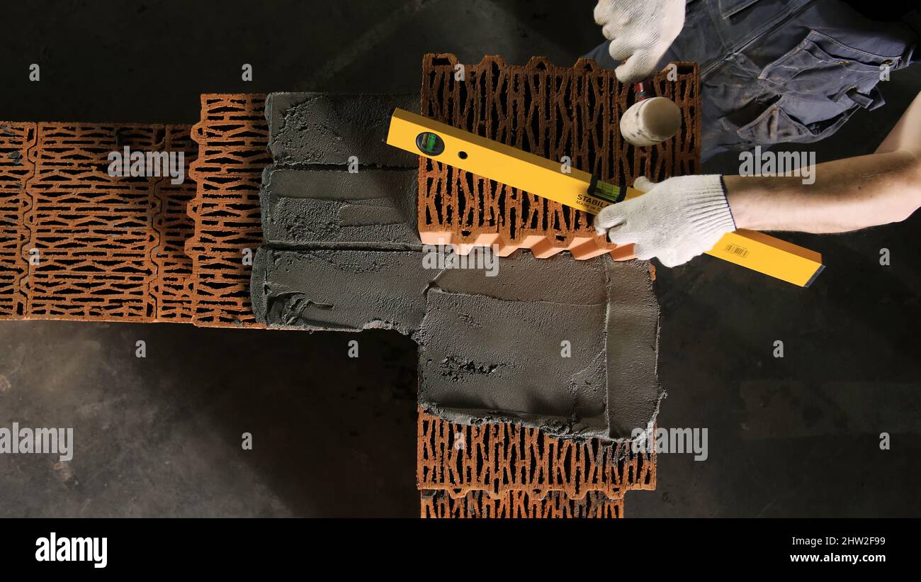Craftsman man laying blocks hi-res stock photography and images - Alamy