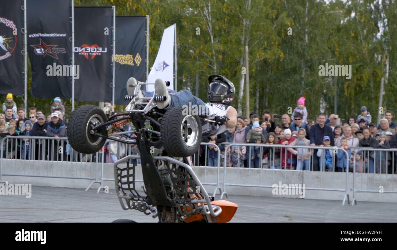 Yekaterinburg, Russia-August, 2019: Man performs tricks on a Quad bike ...