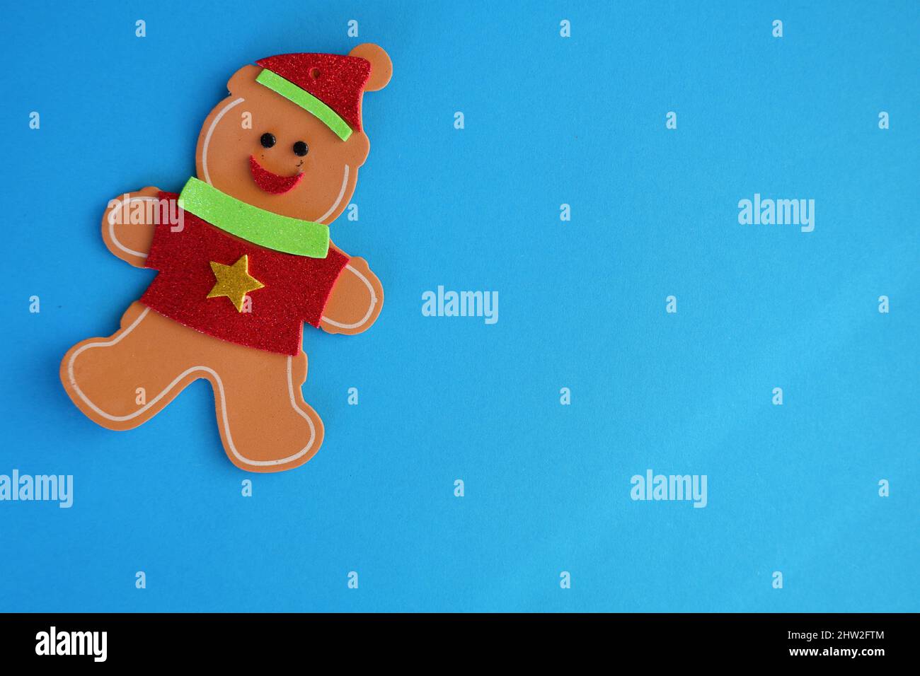 Artificial Christmas gingerbread man over the blue surface Stock Photo ...