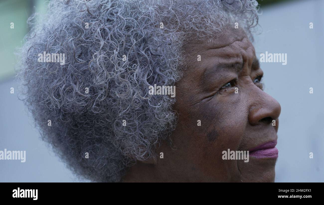 A meditative senior woman portrait face closeup in contemplation Stock ...
