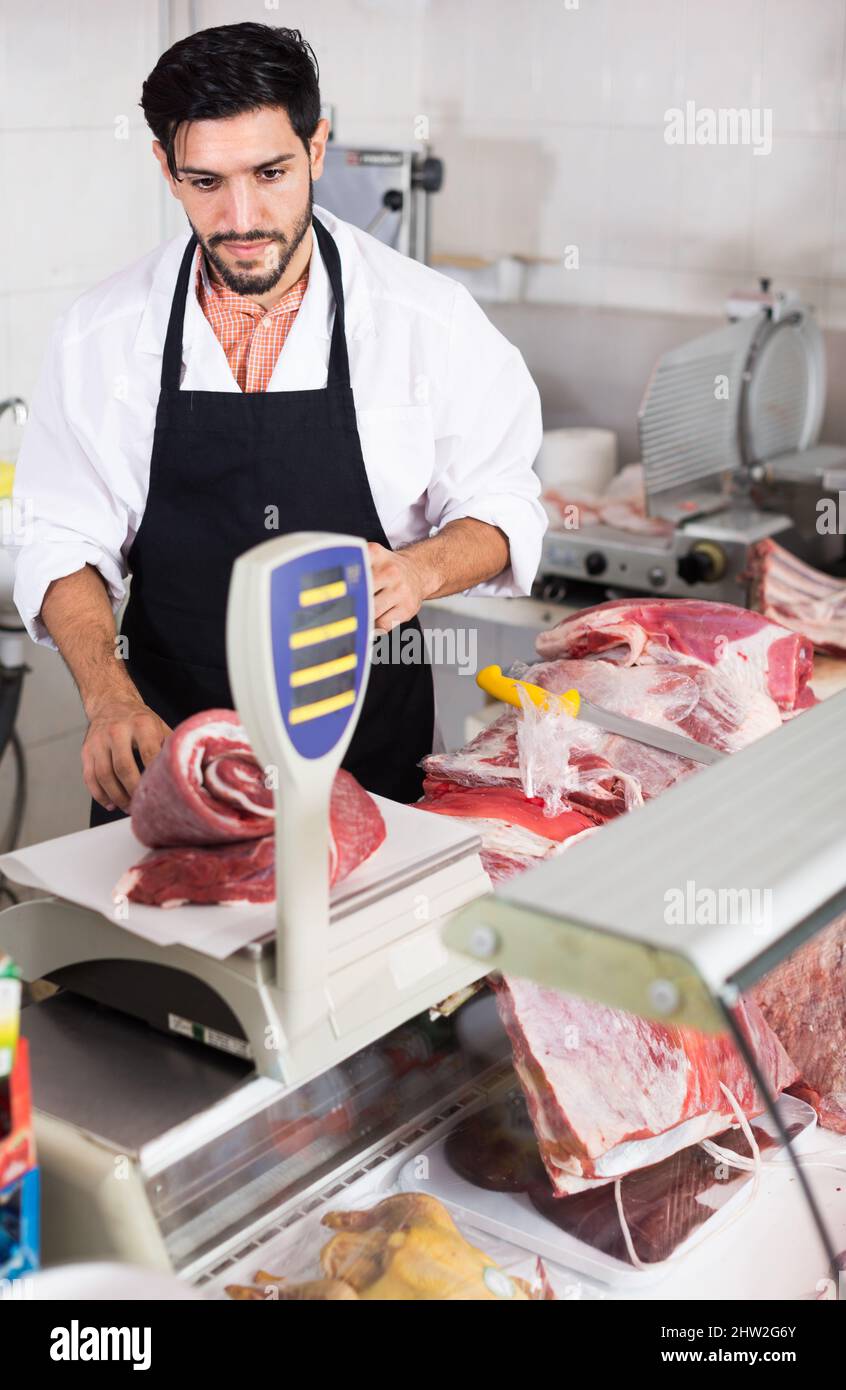 Pork butcher weigh hi-res stock photography and images - Alamy