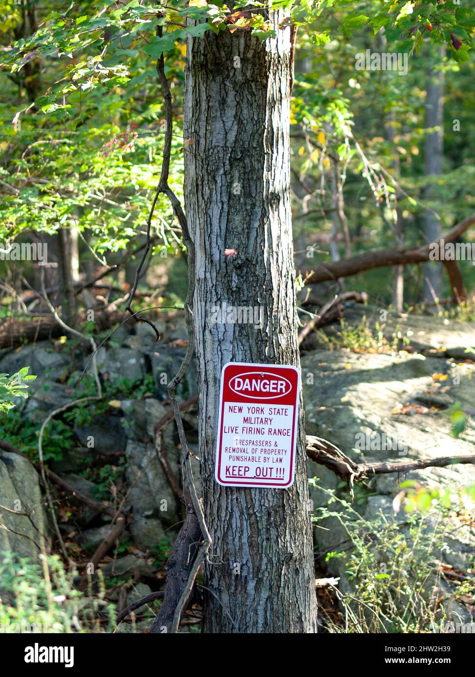 warning sign on trail along military boundary unexploded ordinance keep ...